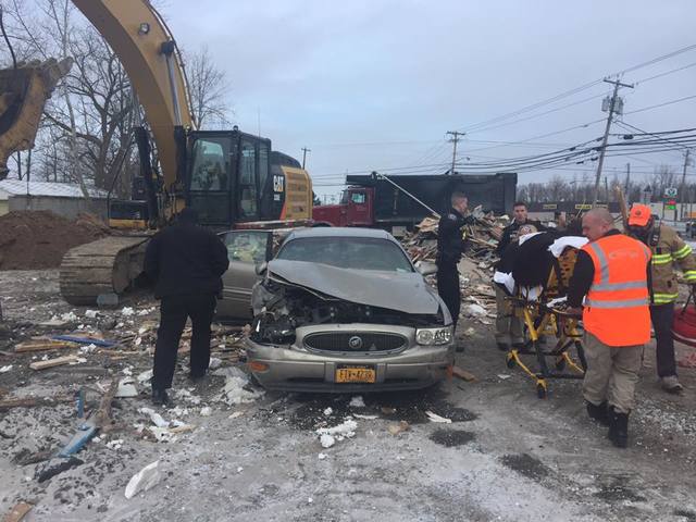 Police: Vehicle goes airborne and strikes excavator at construction ...